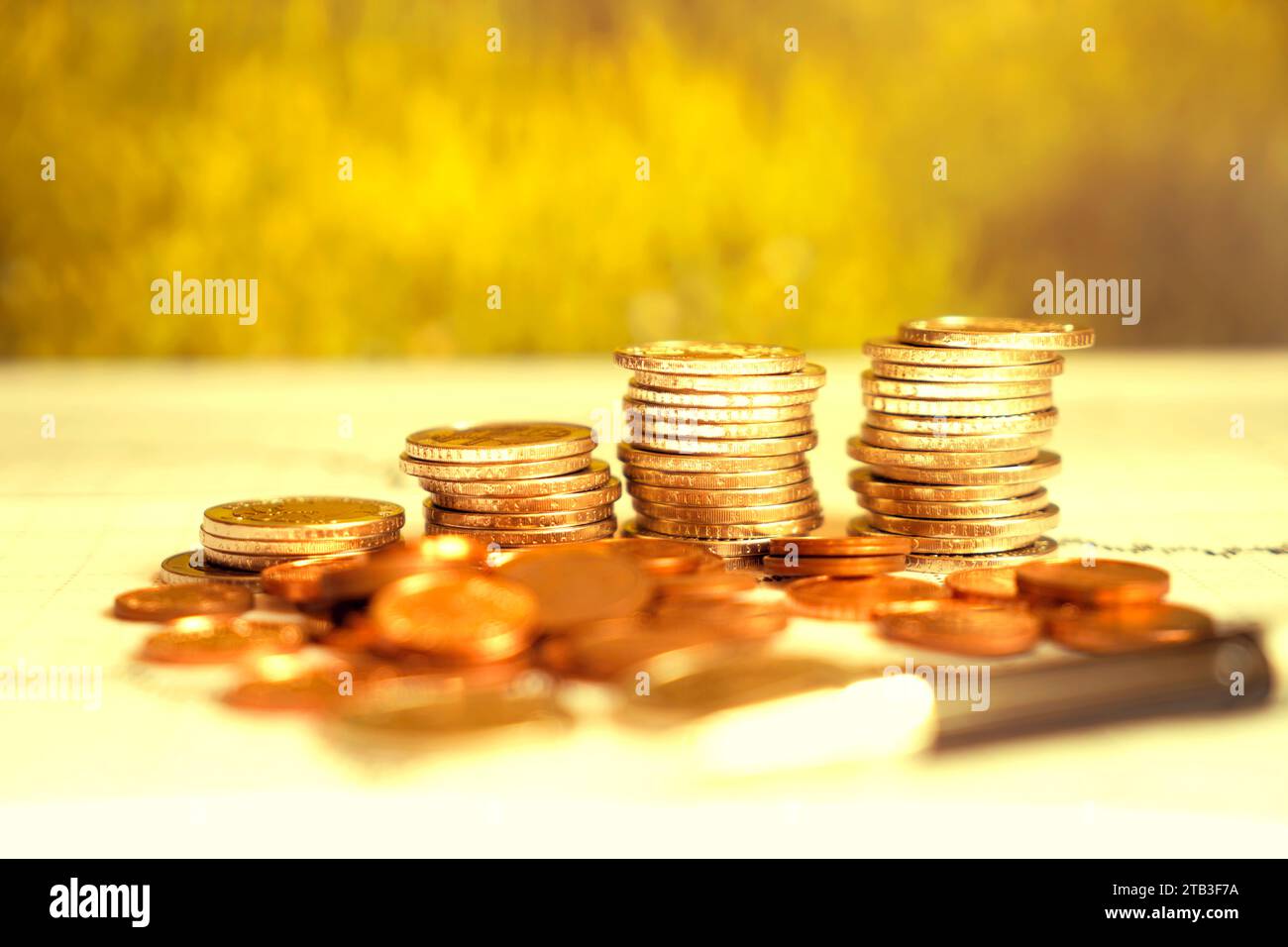 Coin stack blur light hi-res stock photography and images - Alamy