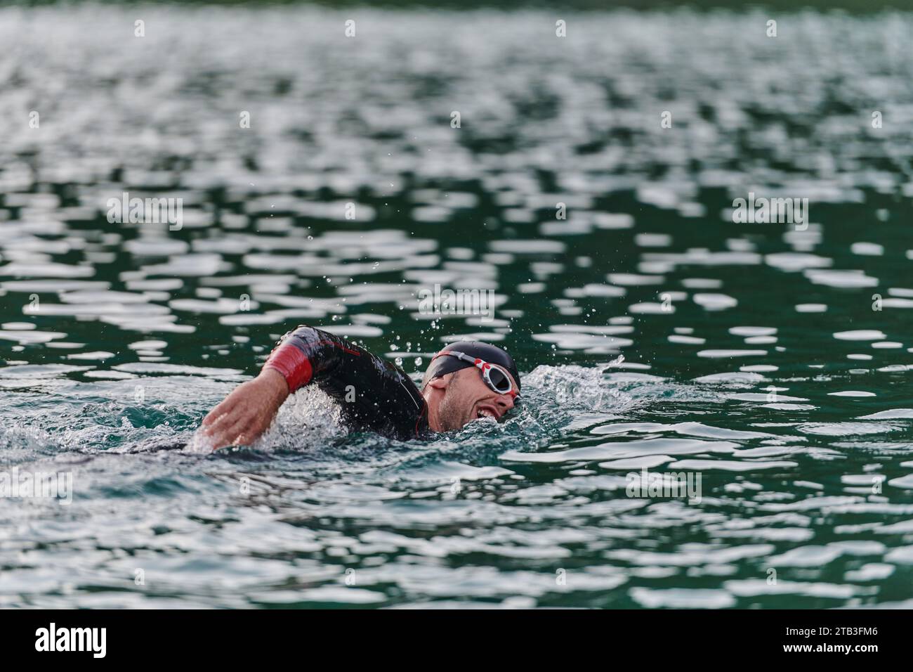 A professional triathlete trains with unwavering dedication for an ...