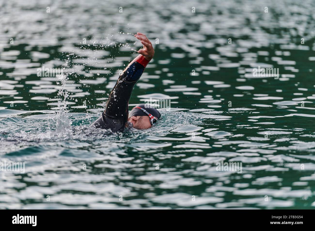 A professional triathlete trains with unwavering dedication for an ...