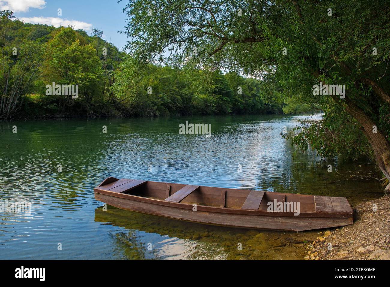 A wooden boat on the River Una near Martin Brod, Bihac, in the Una ...
