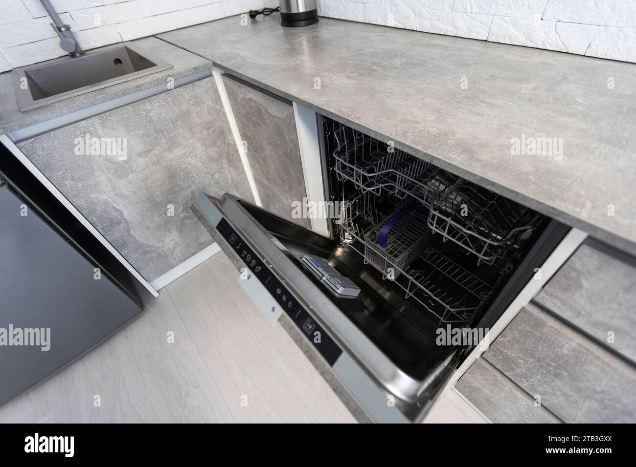 Dishwasher integrated in a modern kitchen Stock Photo - Alamy