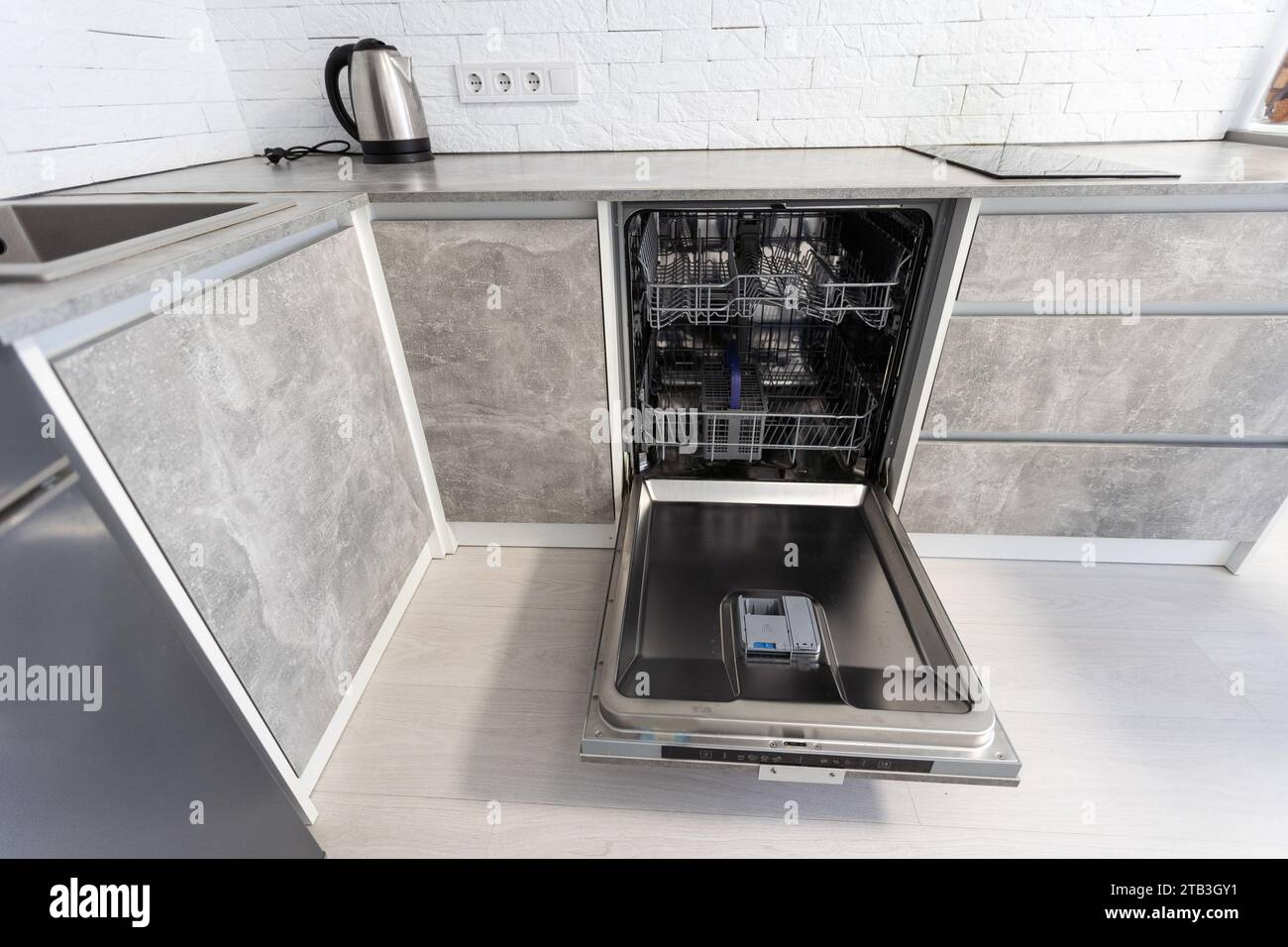 Dishwasher integrated in a modern kitchen Stock Photo - Alamy