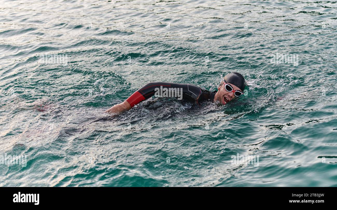 A professional triathlete trains with unwavering dedication for an ...