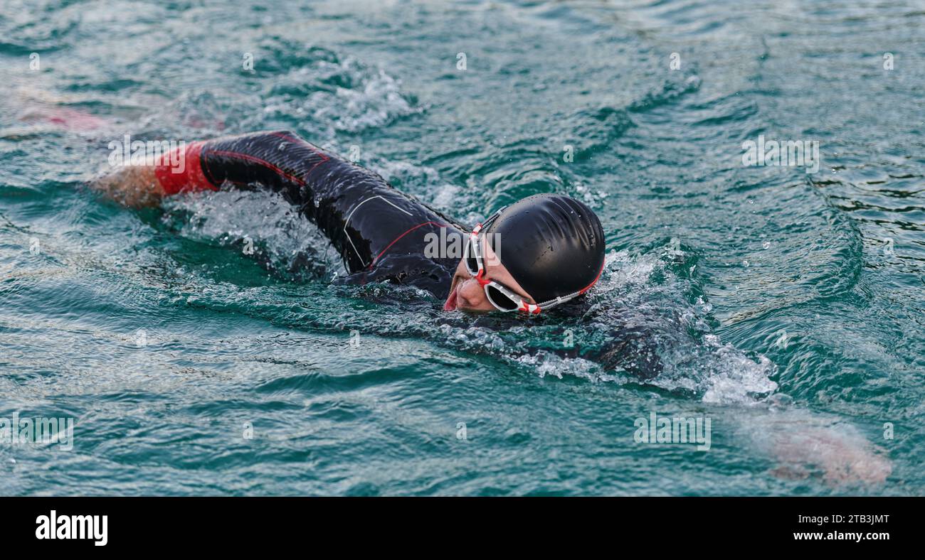A professional triathlete trains with unwavering dedication for an ...