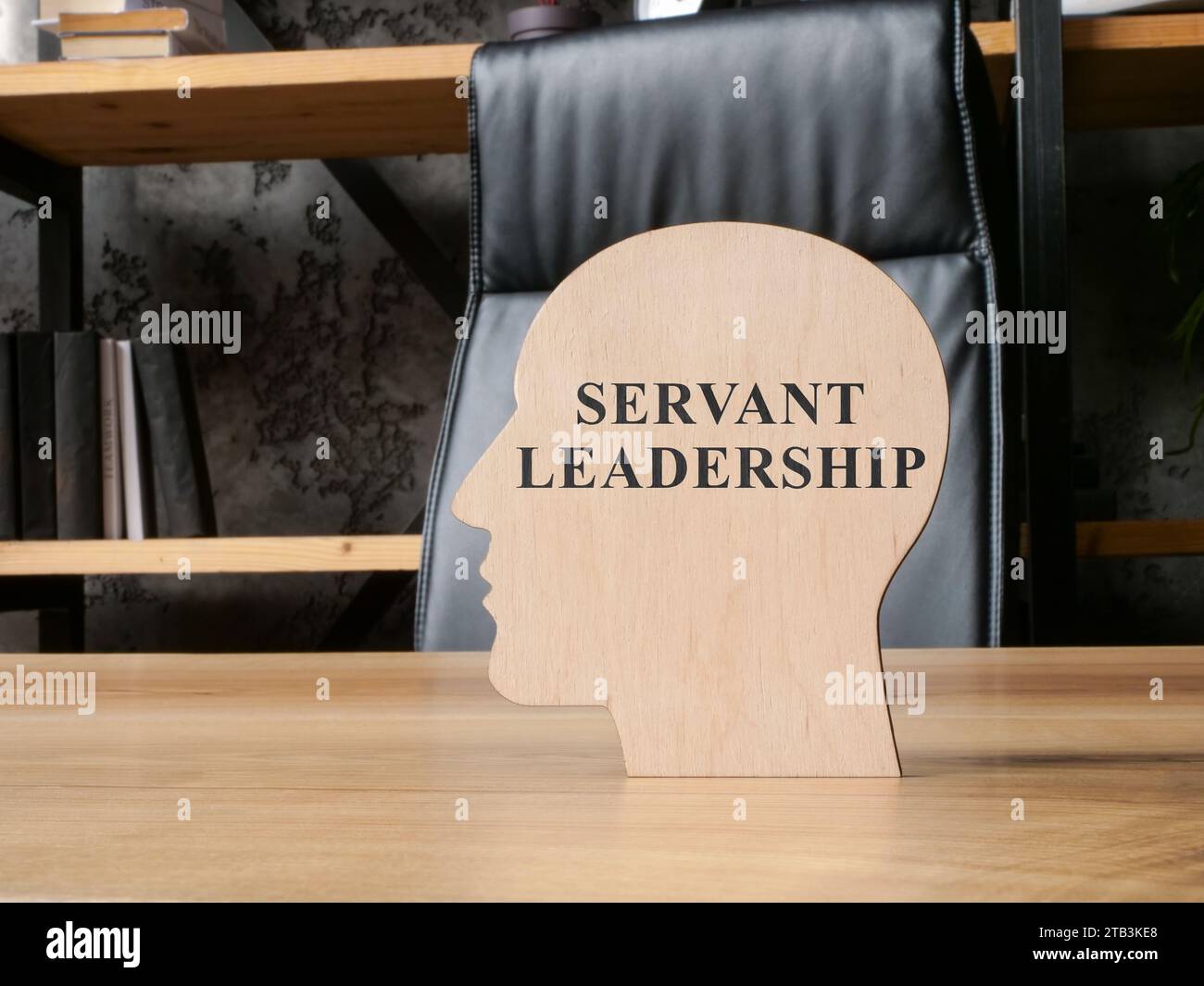 Servant leadership. The outline of the head stands on the office table ...