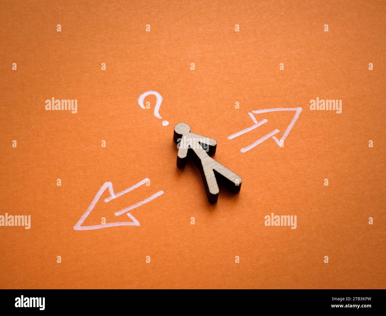 Figurine, arrows and question mark as a symbol of choice Stock Photo ...