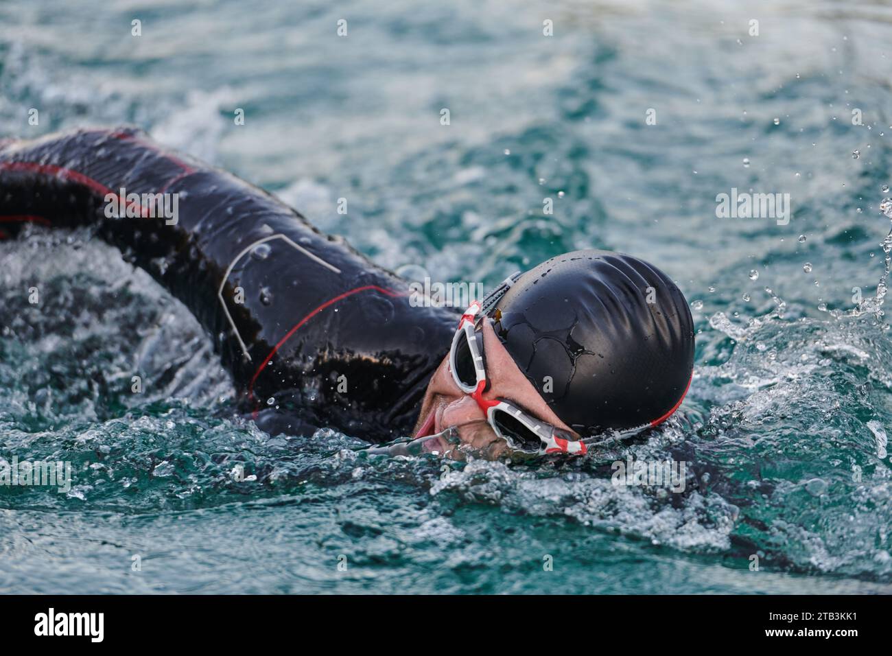 A professional triathlete trains with unwavering dedication for an ...