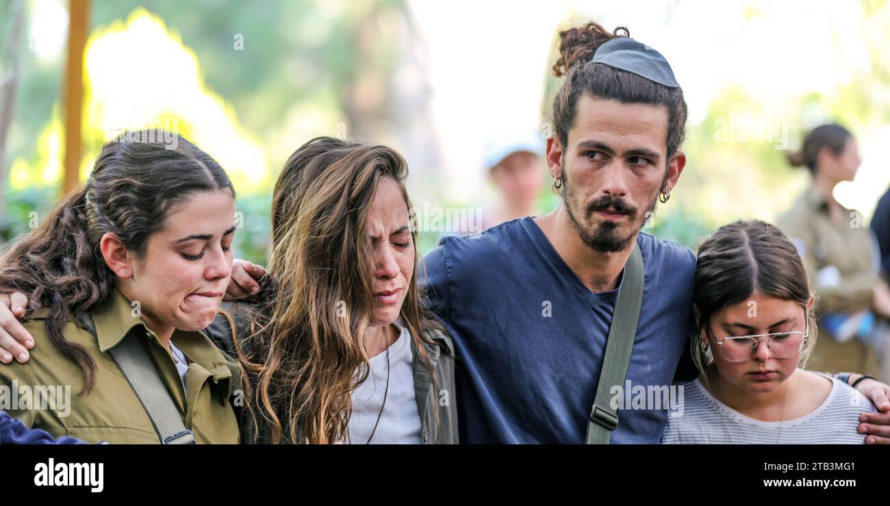 Jerusalem, Israel. 4th December 2023. A maiden near the fresh grave of ...