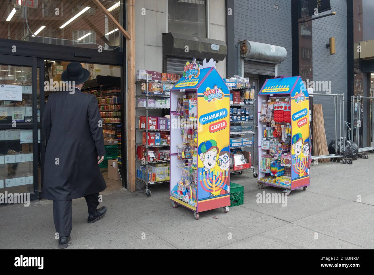 2 Chanukh Center booths with toys & games for kids at the entrance to a ...