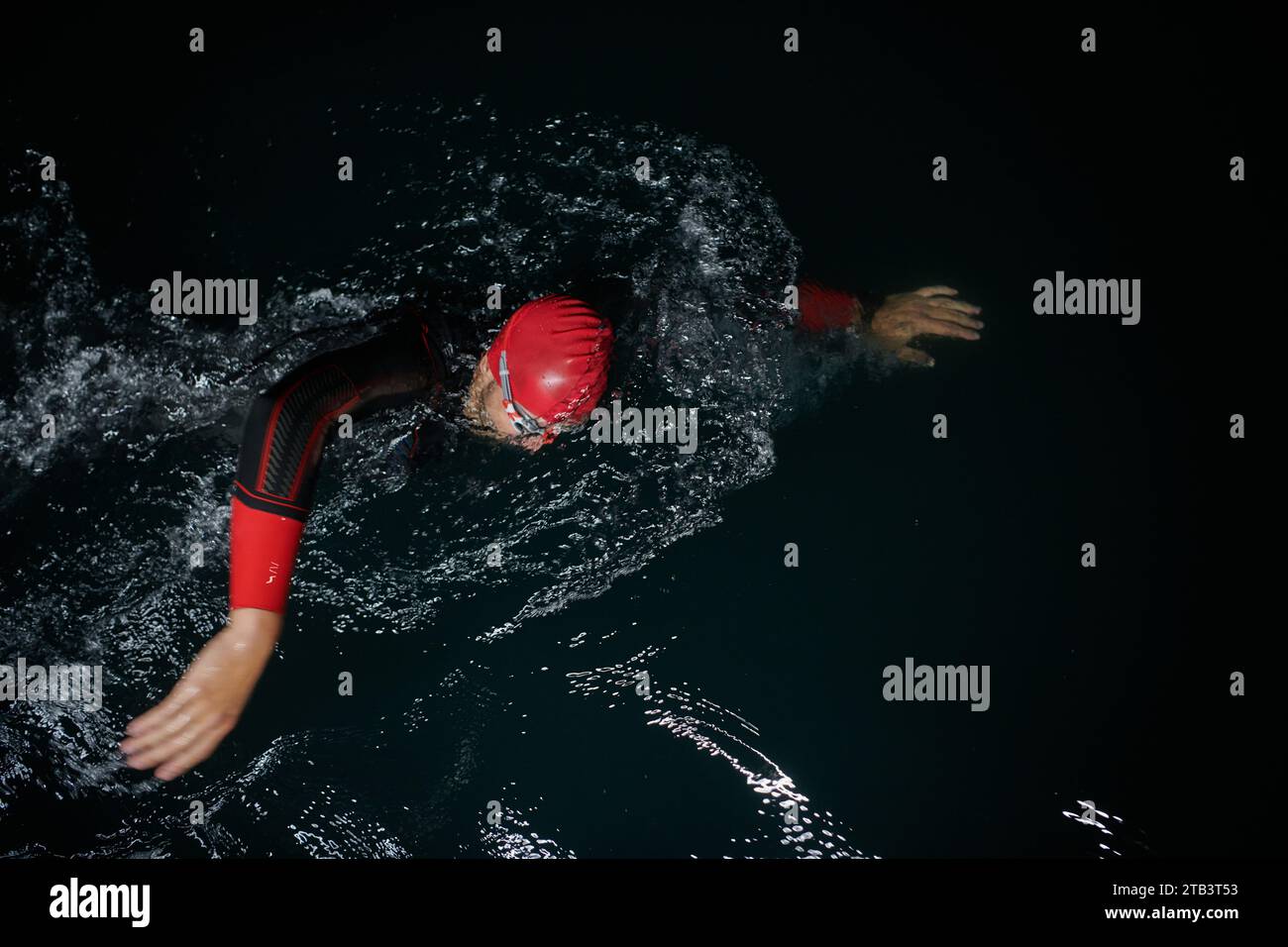 A determined professional triathlete undergoes rigorous night time ...