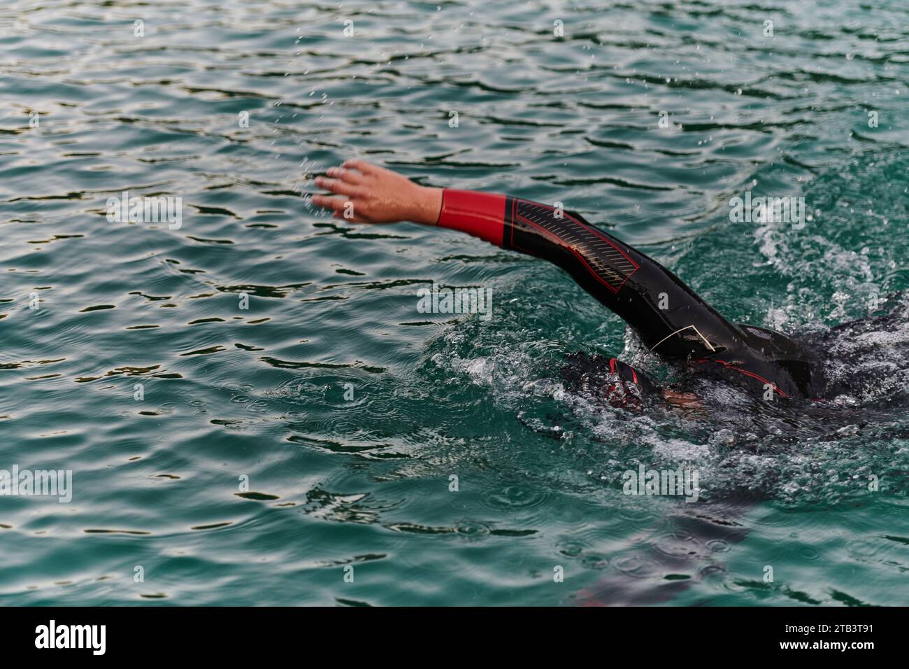 A professional triathlete trains with unwavering dedication for an ...
