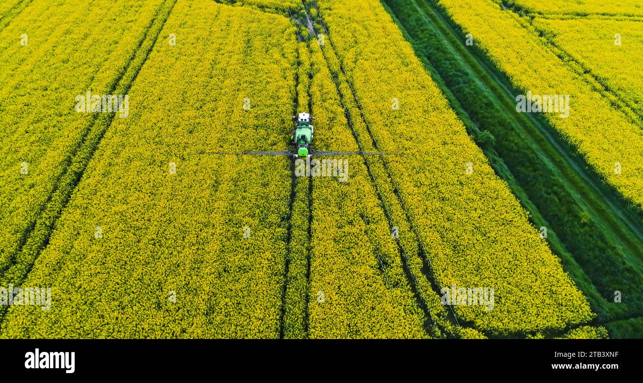 Farmer spraying field with pesticides - AGRICULTURE Aerial Stock Photo ...