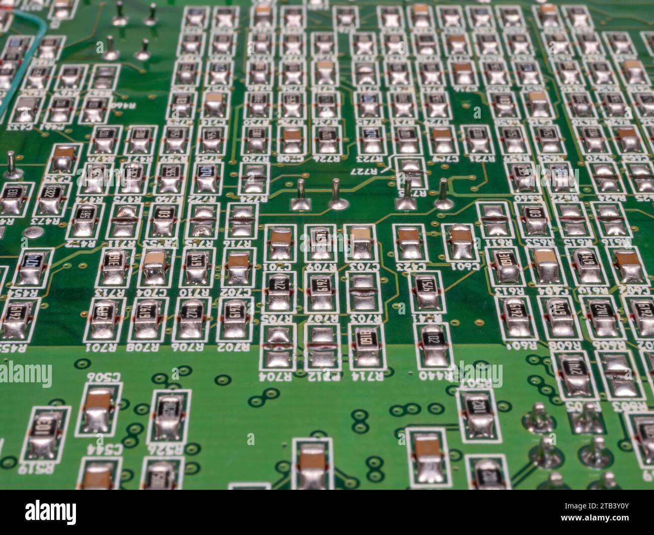 Green circuit board with many components on it. Selective focus Stock ...