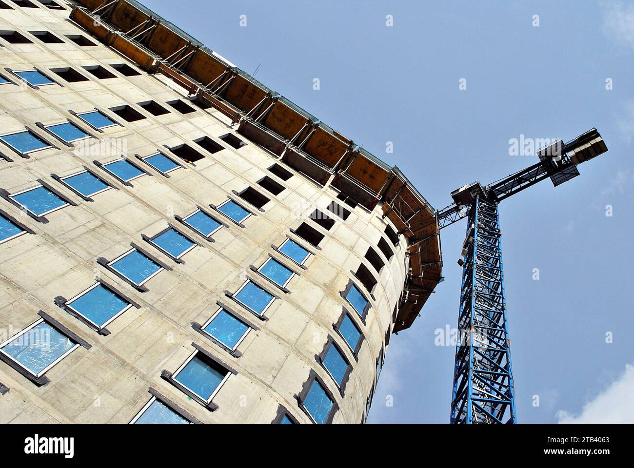 High rise building under construction. Installation of glass facade ...