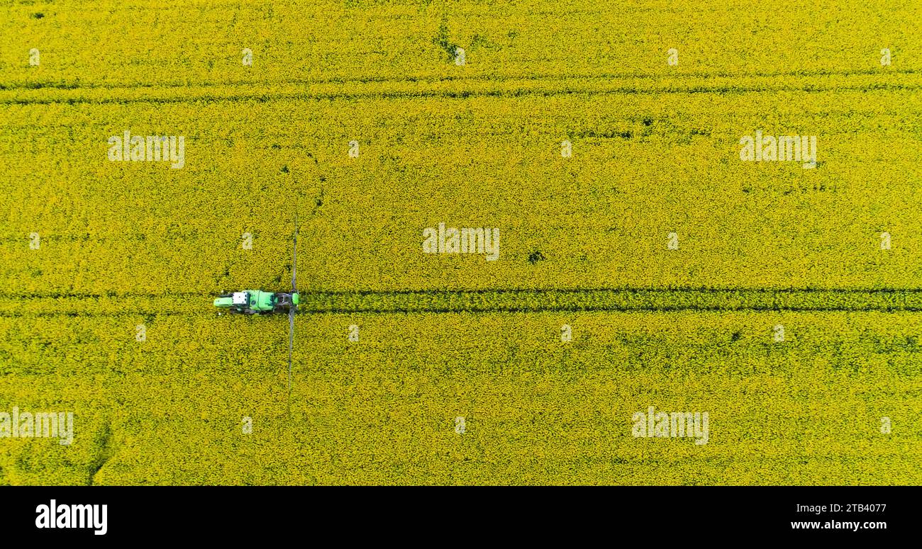Agriculture Aerial Of Tractor Spraying Farm Land With Pesticides Stock ...
