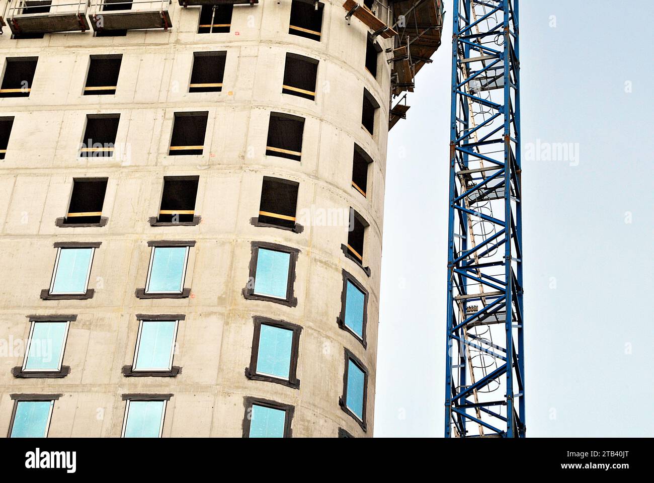 High rise building under construction. Installation of glass facade ...