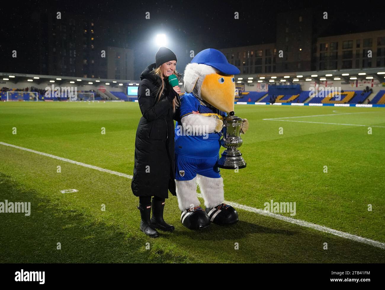 Presenter Laura Woods and AFC Wimbledon mascot Haydon with the FA Cup ...