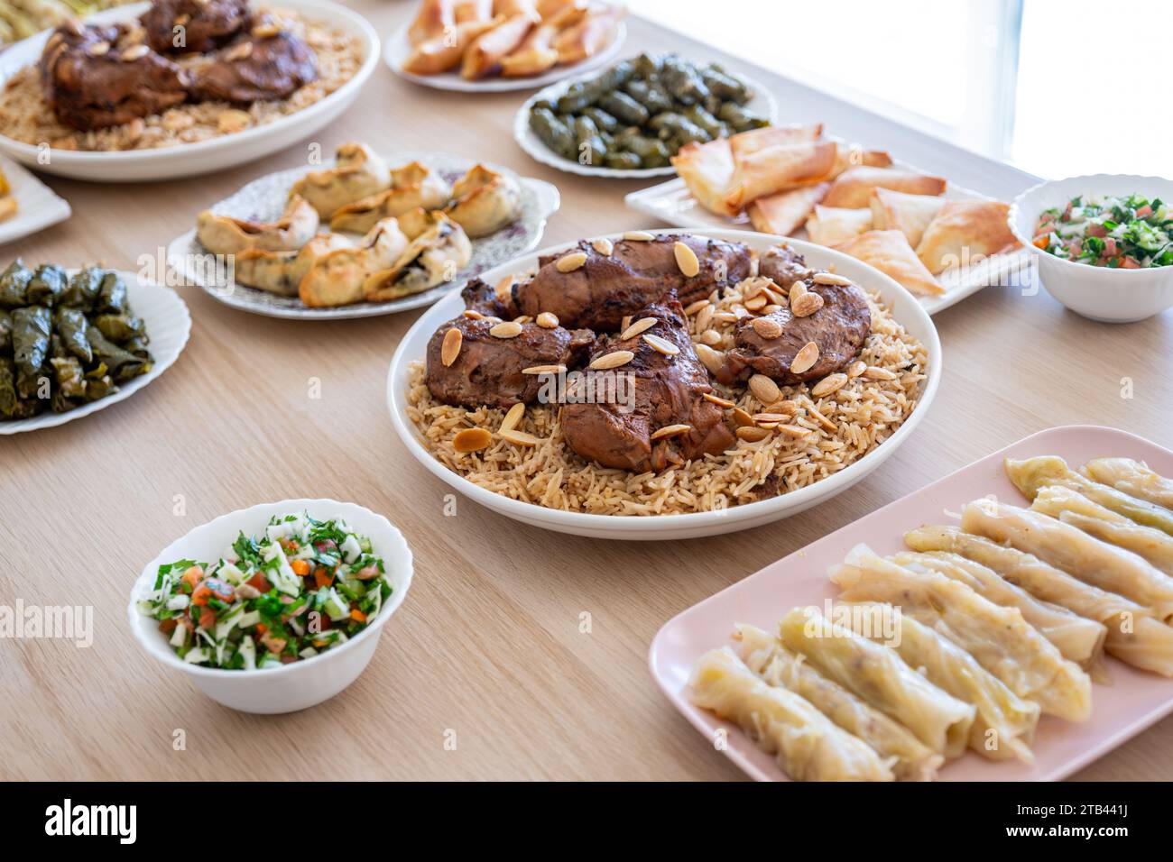 arabian dining table consist of rolls of cabbage rolls of grape , rice ...