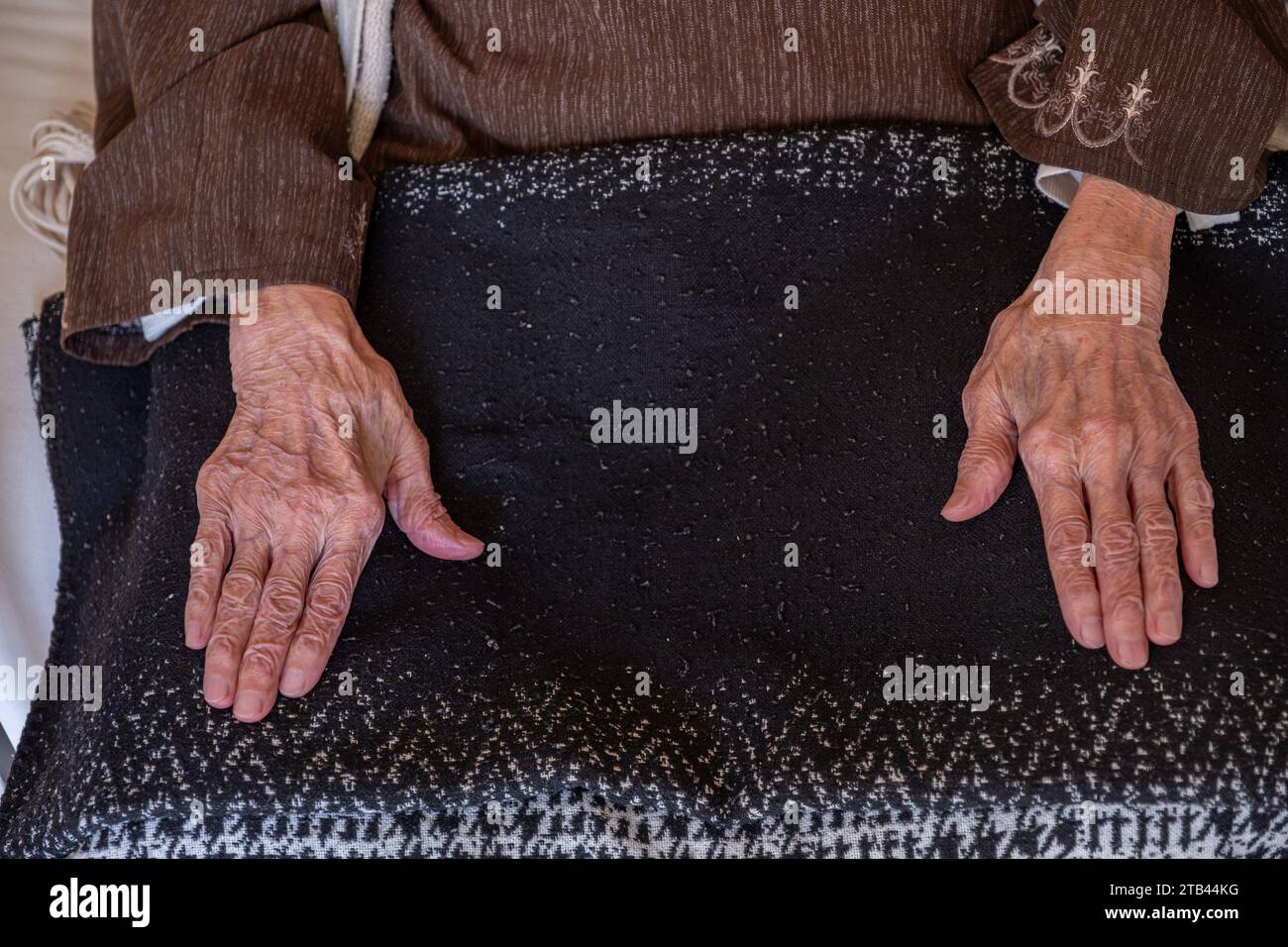 Wrinkled old lady hands on black veil with copy space Stock Photo - Alamy
