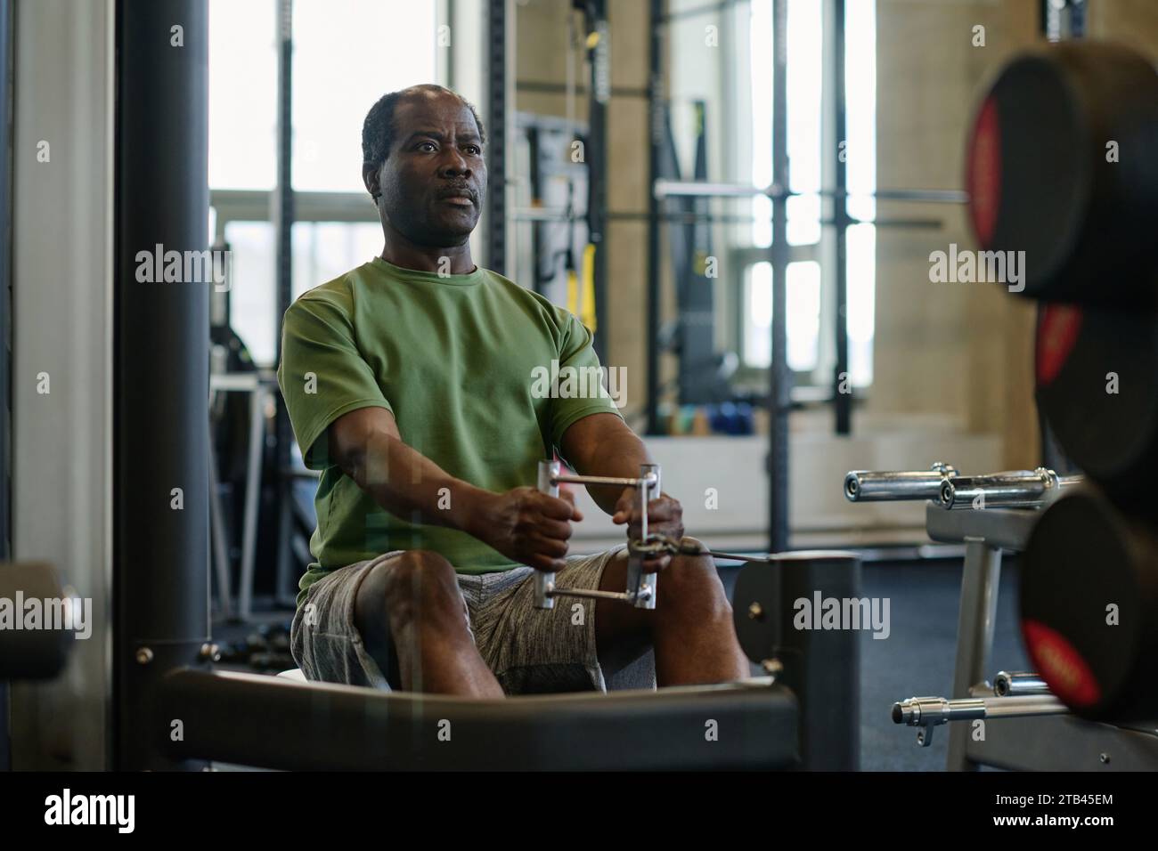 Medium full shot of elderly african american sportsman doing abs ...