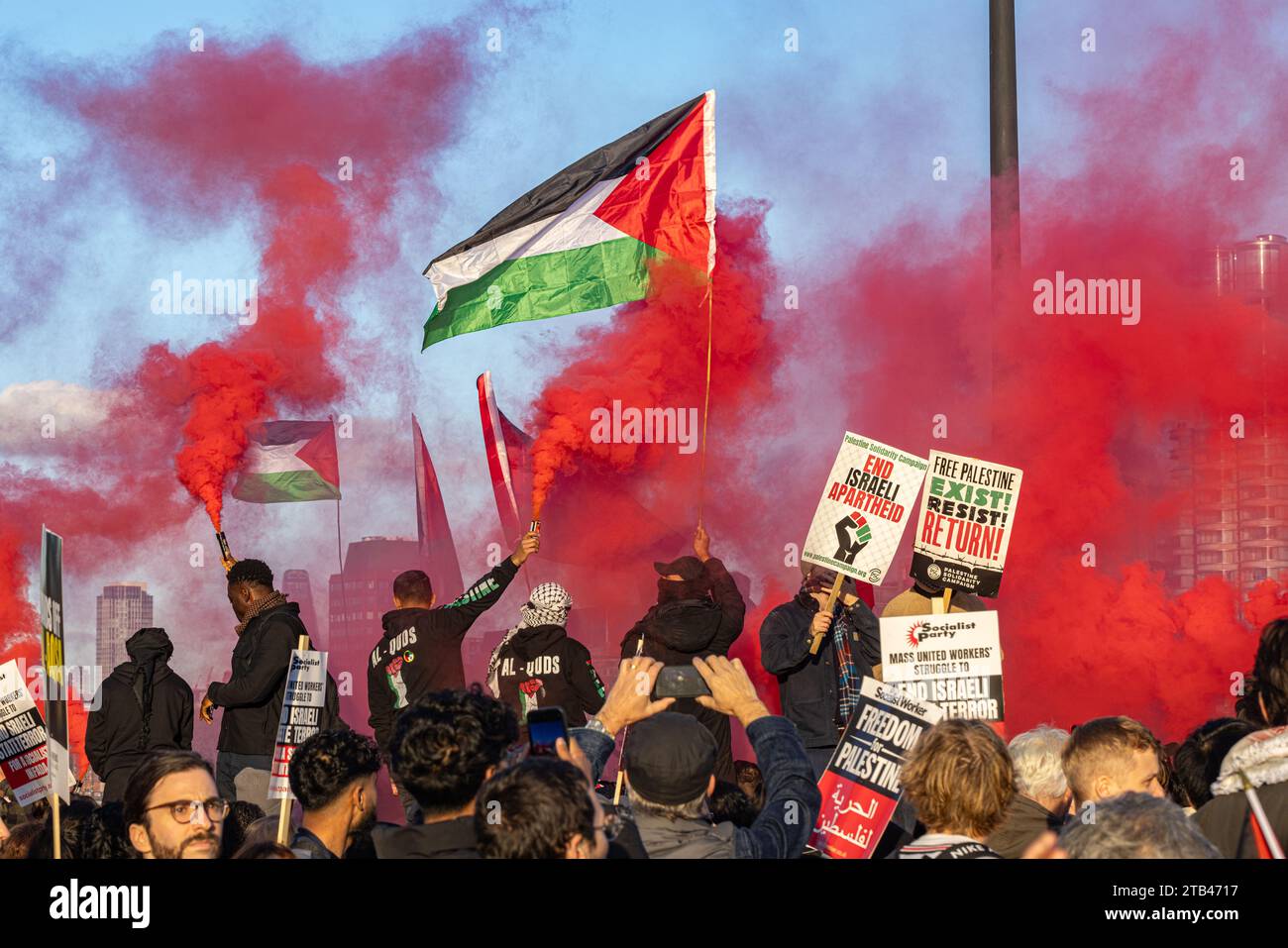 Pro-Palestinian protestors march for a Gaza ceasefire in London waving ...