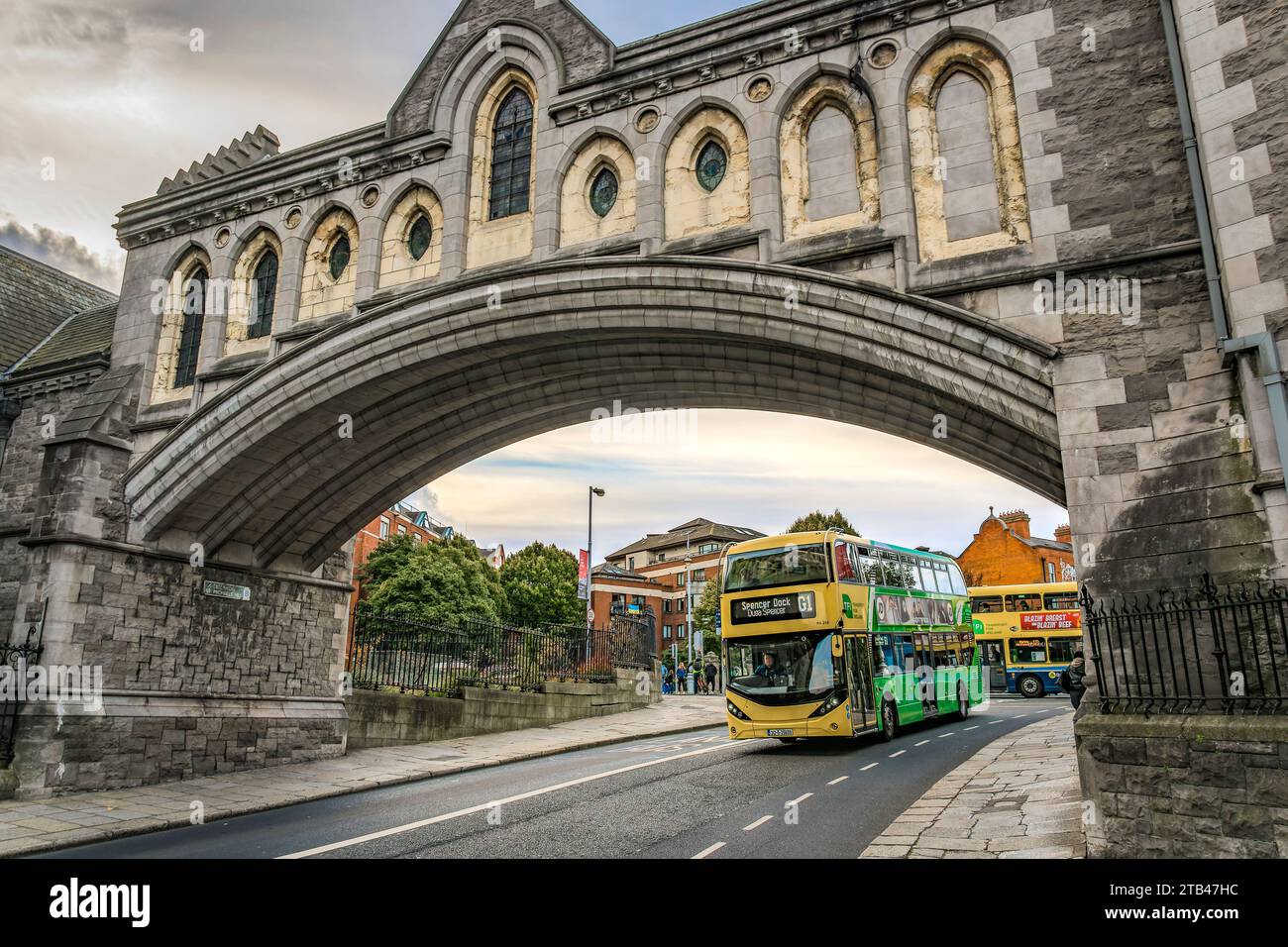 Dublin bus under arched footbridge connecting Christ Church Cathedral ...