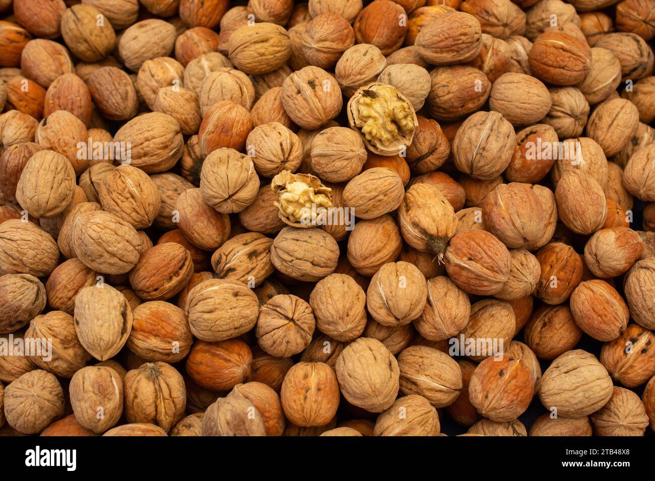 Whole walnuts background. Healthy organic food concept Stock Photo - Alamy