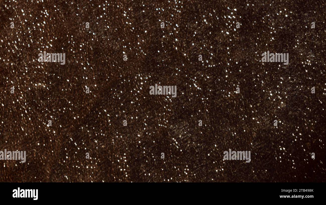 Light reflections on a glass pane, abstract black-brown background ...