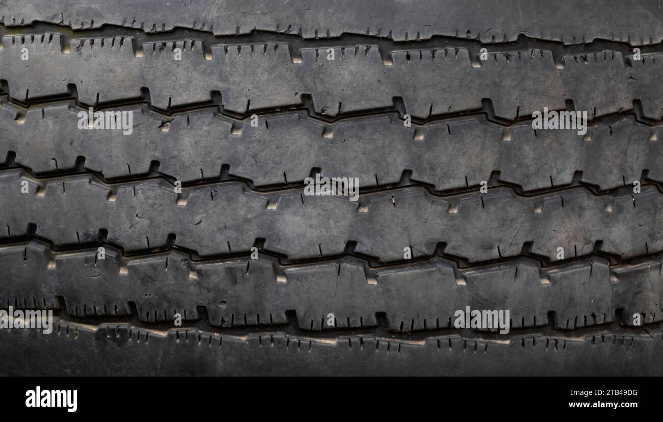 Detailed view of a worn car tyre, background Stock Photo - Alamy
