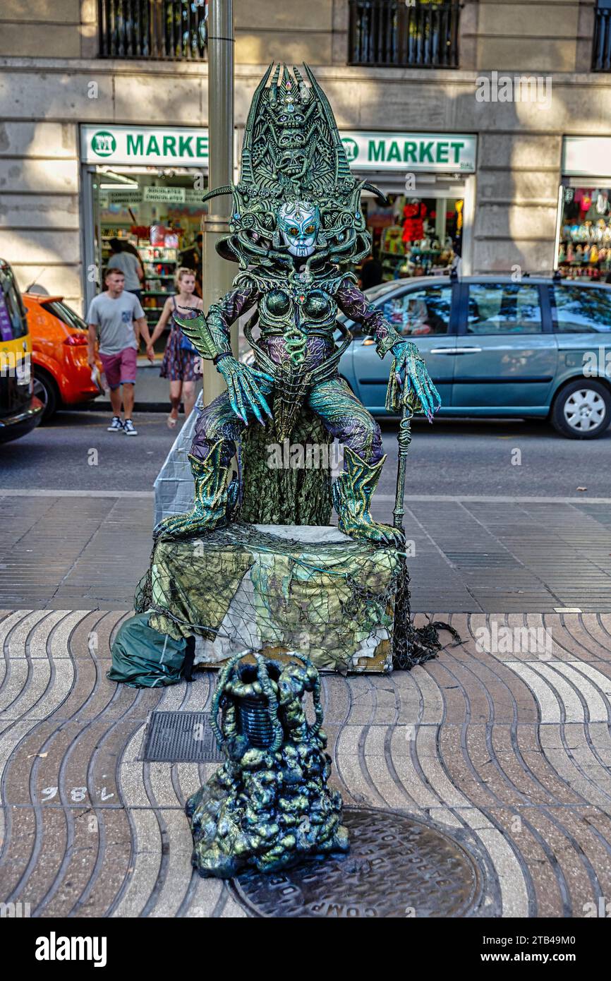 Street performer, mime, living statue of an alien, fantasy figure on ...