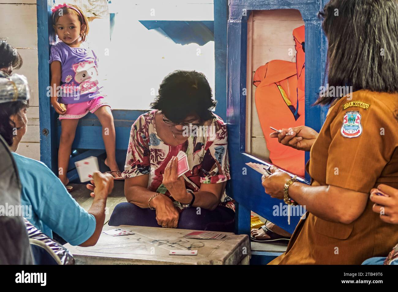 Women playing cards boats on a ferry boat leaving the port of this ...