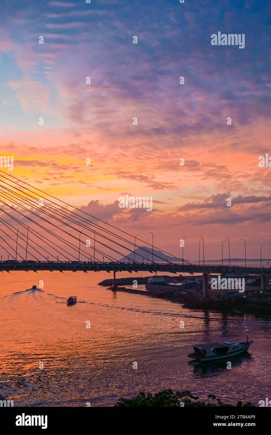 Manado port & Soekarno Bridge at sunset in the provincial capital of ...