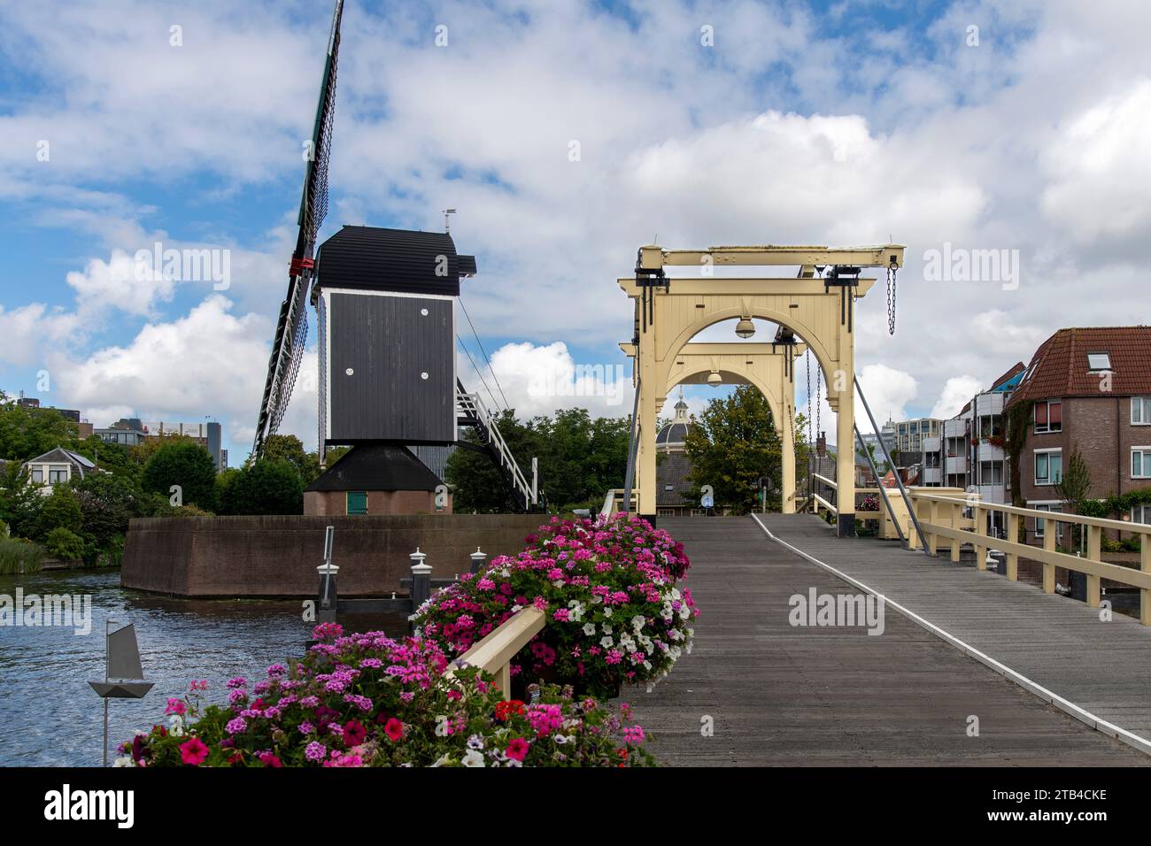 Historic windmill De Put and Rembrandt bridge in the Rijn River in the ...
