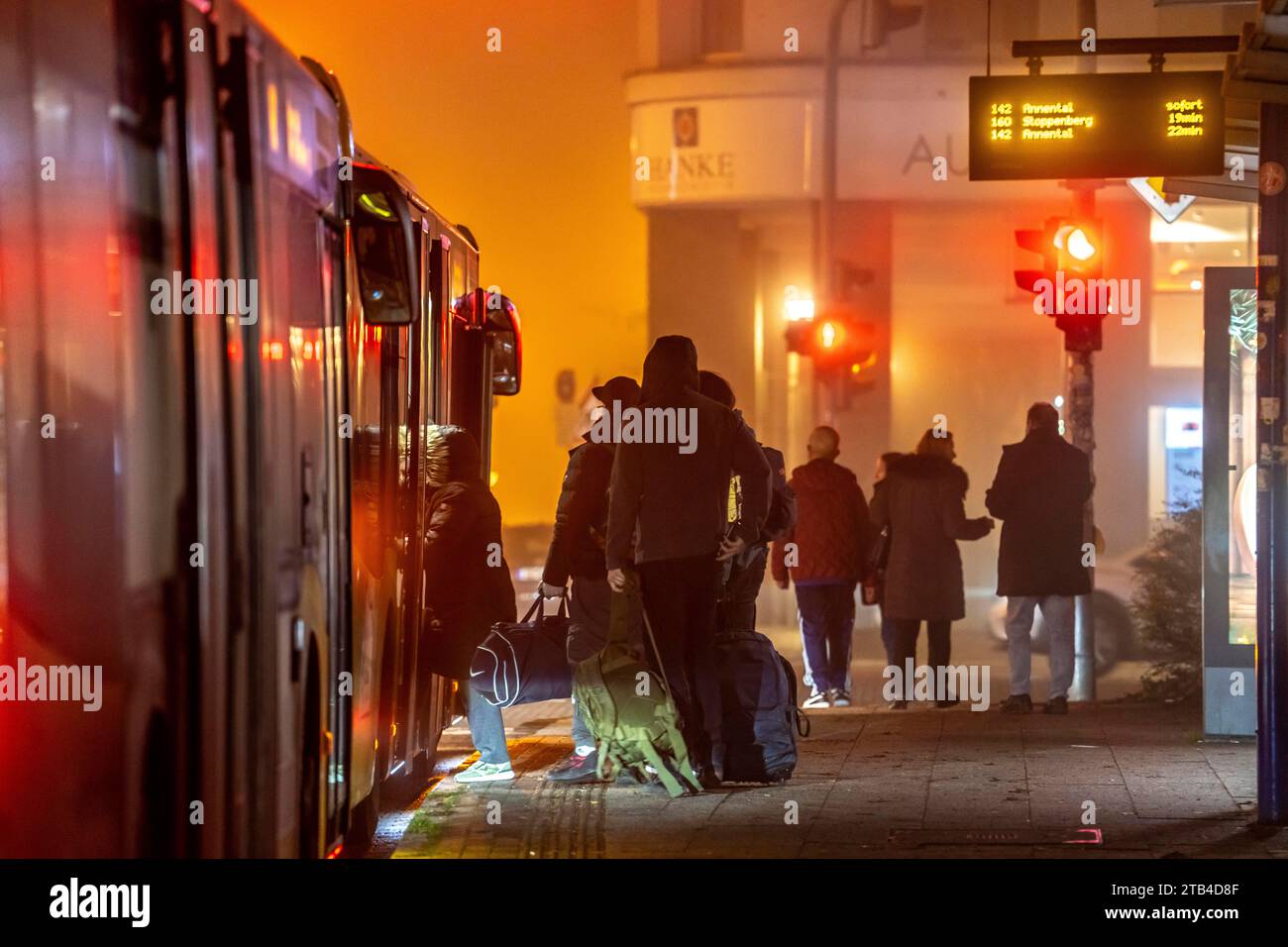 Bus stop, in the fog, passengers boarding a bus, autumn, winter, Essen ...