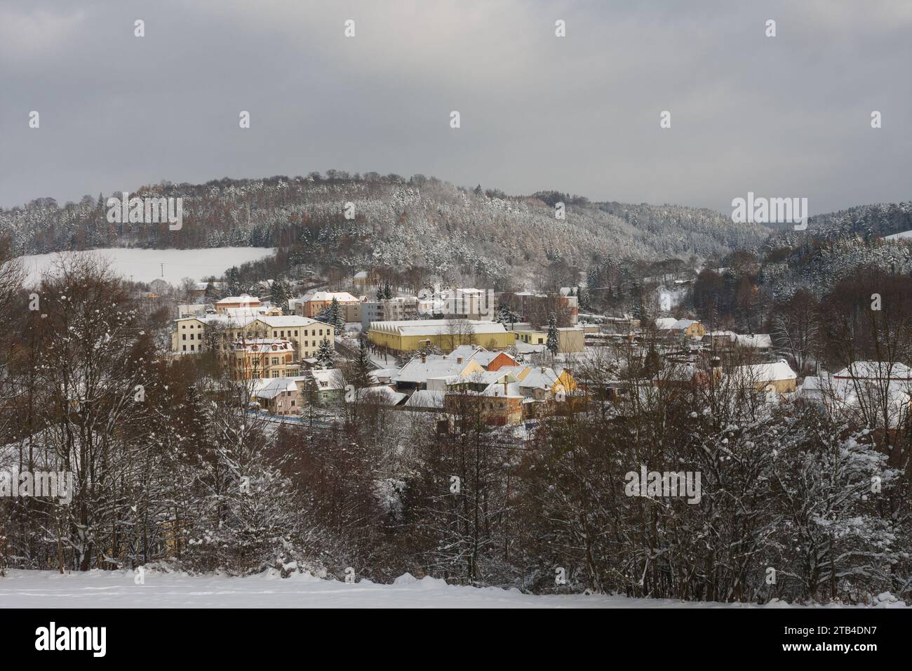 Apartment buildings and textile factory on in small town, winter ...