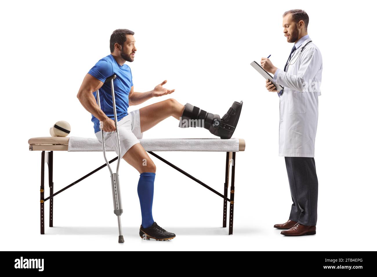 Football player with a leg injury talking to a male doctor isolated on ...