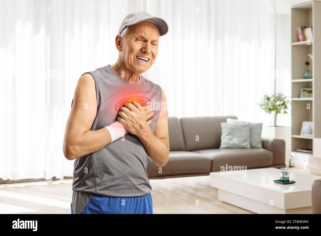 Elderly man with pain in the chest at home in a living room Stock Photo ...