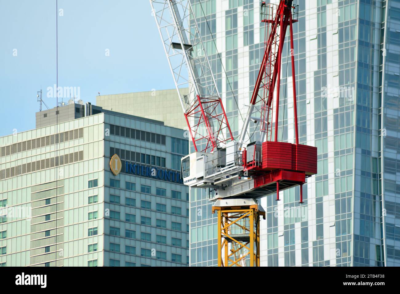 High rise building under construction. Installation of glass facade ...