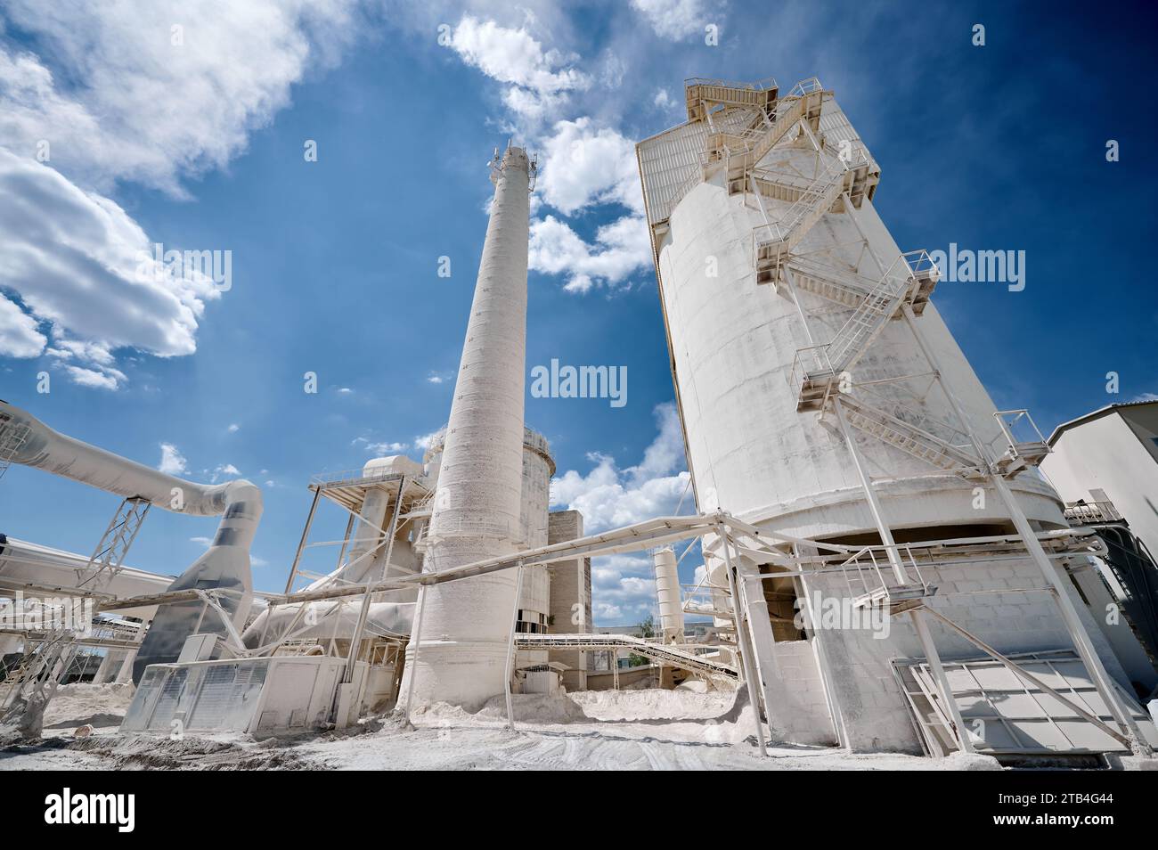 High concrete silos for storage of finished lime products Stock Photo ...