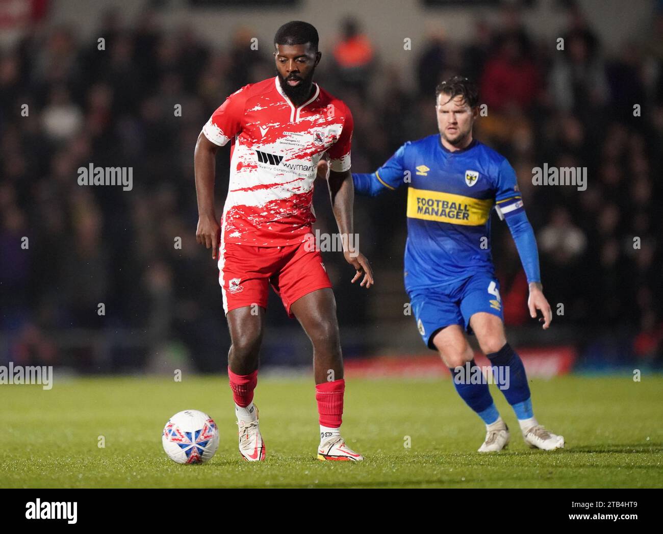 Ramsgate's Medy Elito and AFC Wimbledon's Jake Reeves during the ...