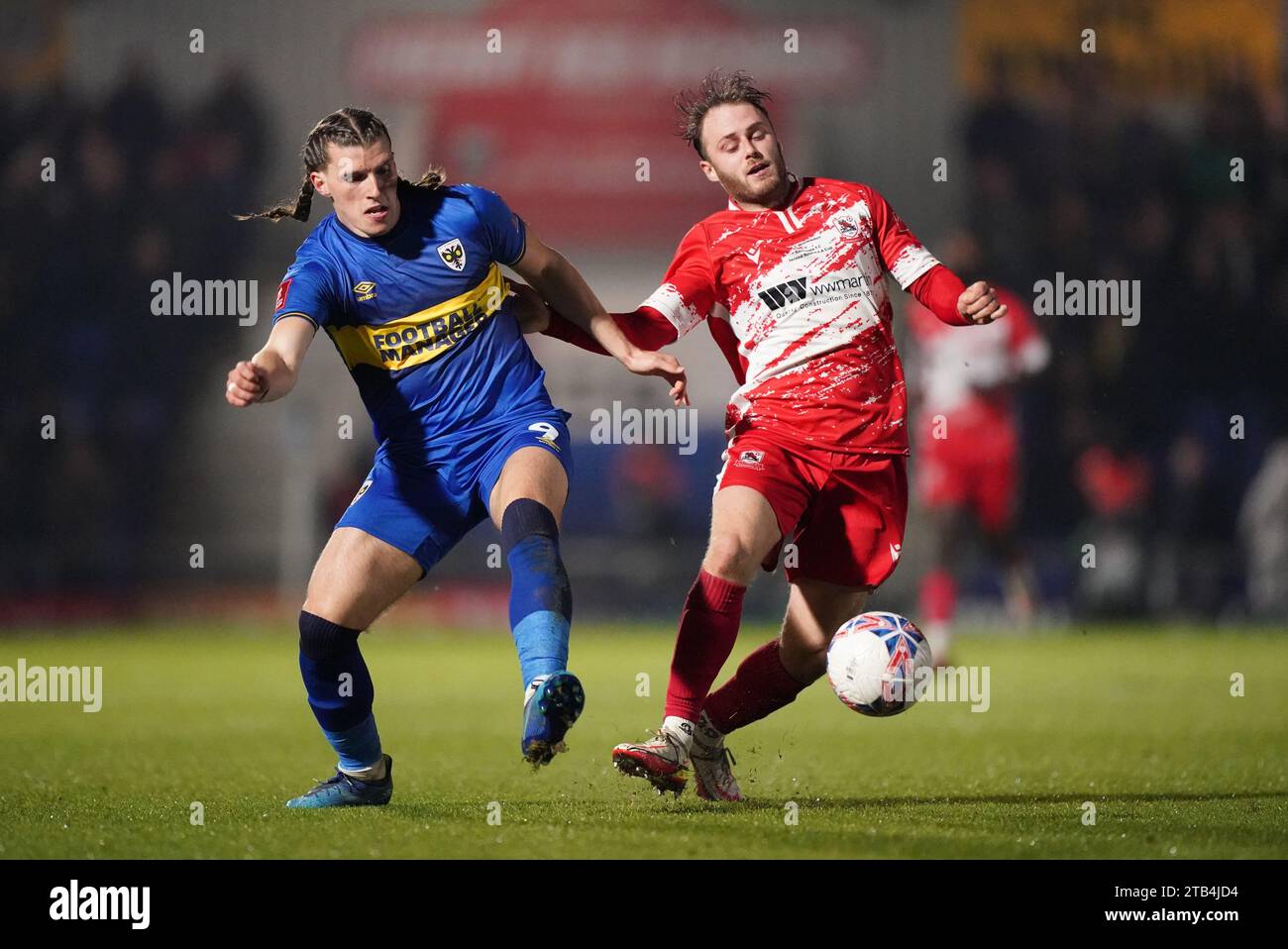 AFC Wimbledon's Josh Davison and Ramsgate's Jack Parter battle for the ...