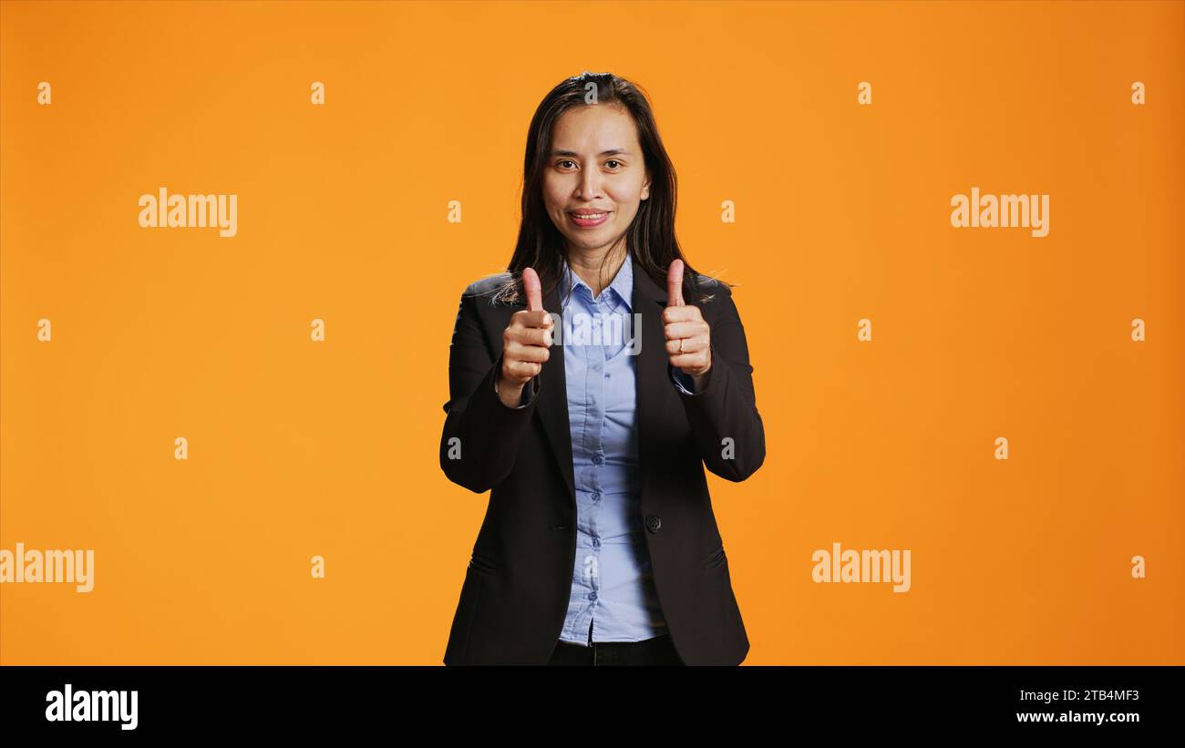 Filipino employee does thumbs up gesture on camera, expressing ...
