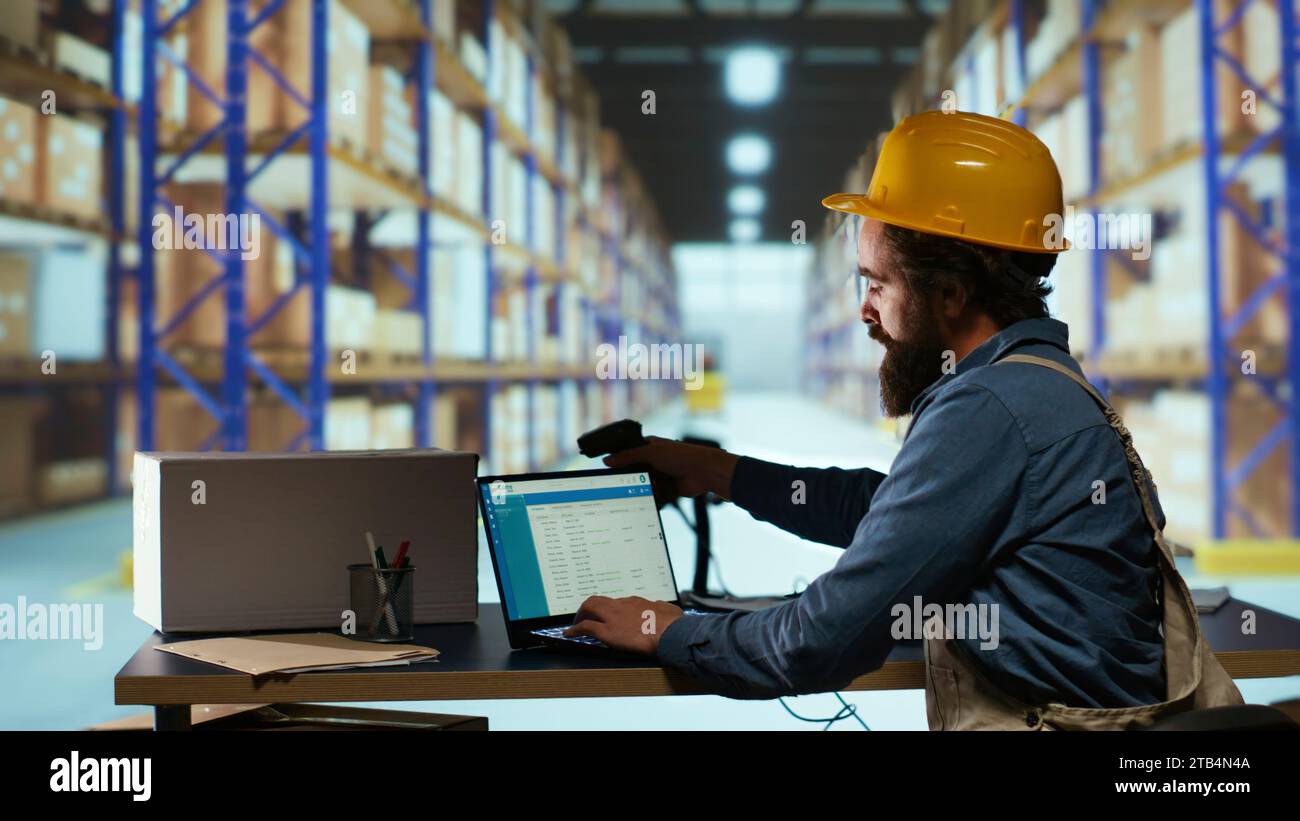 Delivery supervisor scanning barcodes for product logistics, managing ...