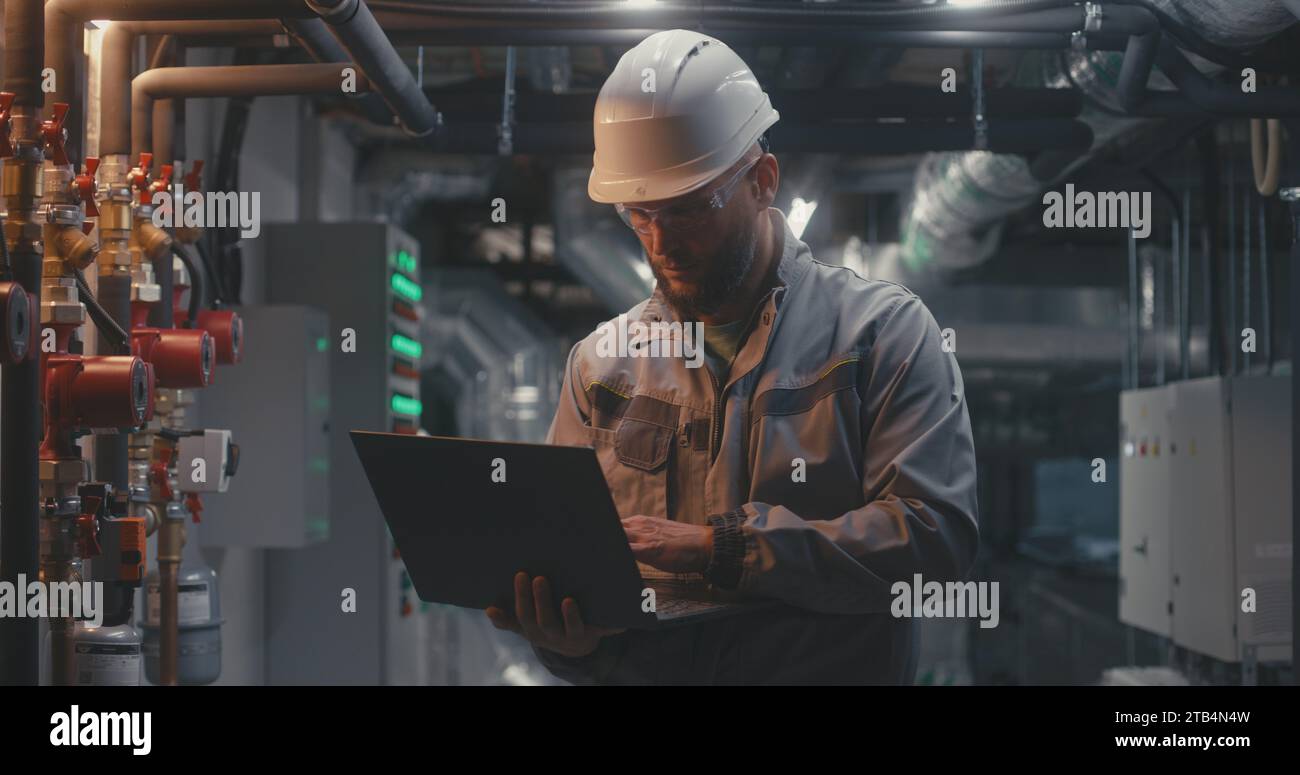 Multiethnic team of factory specialists work on modern factory using ...