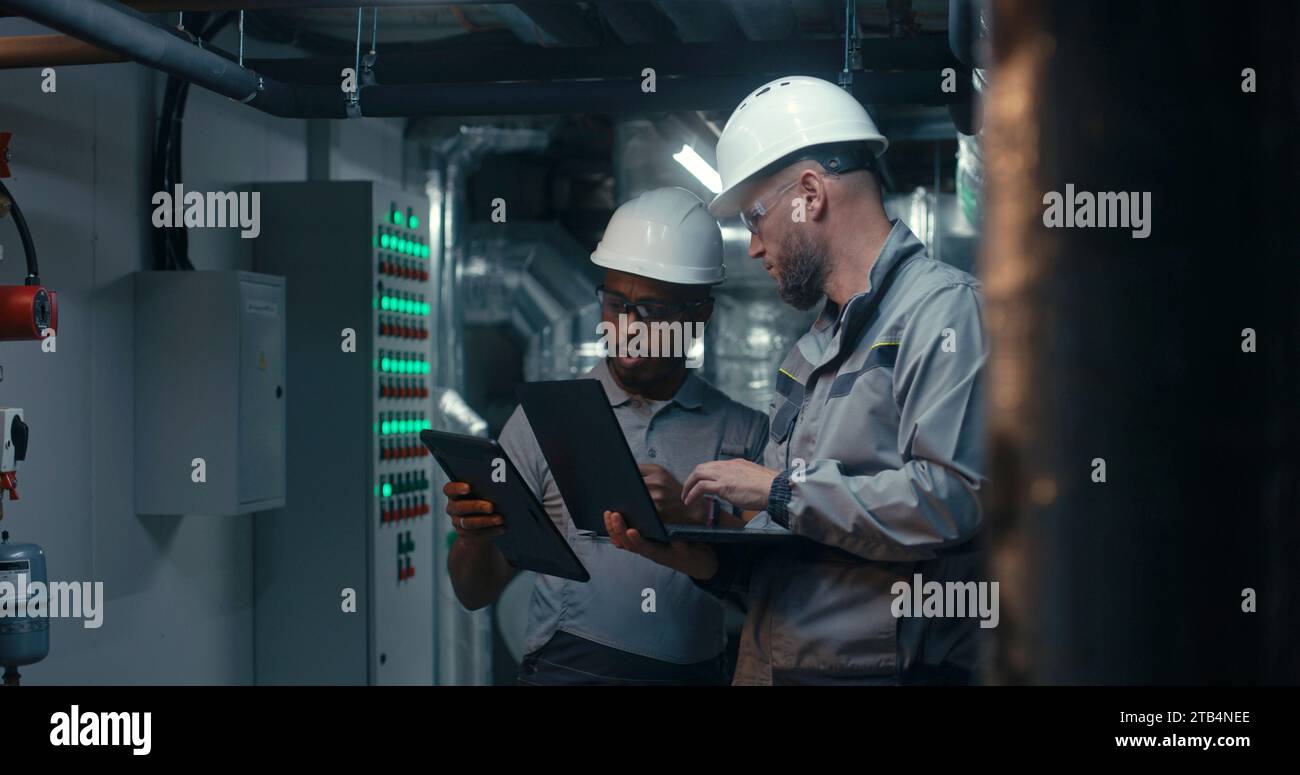 Diverse team engineers laptop tablet hi-res stock photography and ...