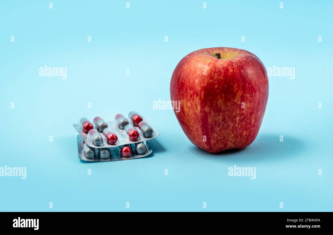 Pills capsules of medicament isolated on blue background versus red ...