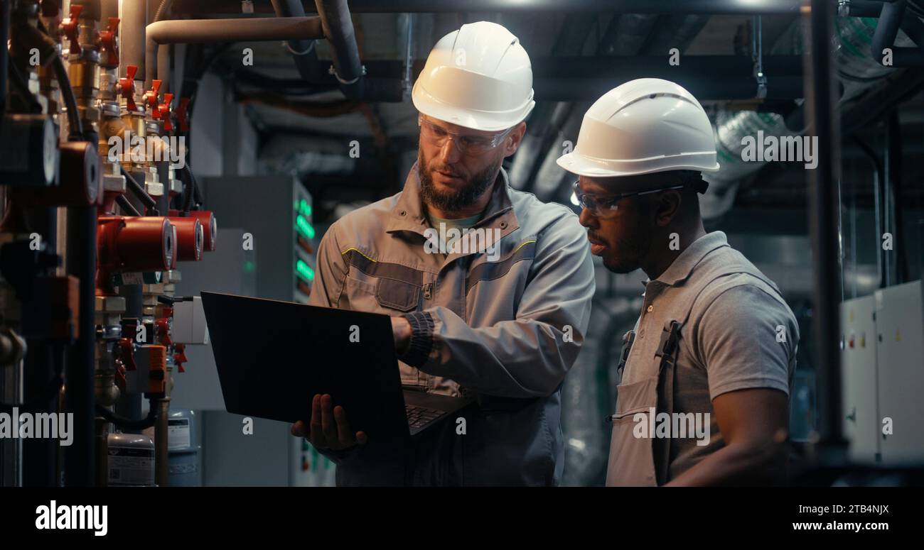 Diverse team engineers laptop tablet hi-res stock photography and ...