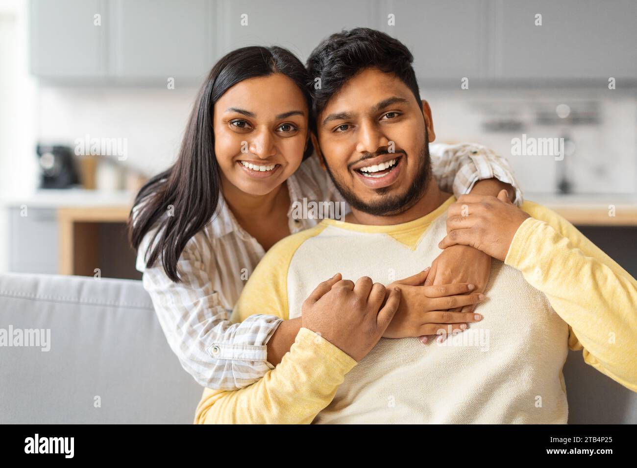 Indian couple hug smile cuddle hi-res stock photography and images - Alamy