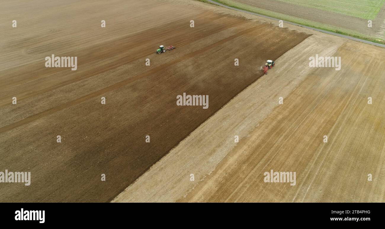 Agriculture - Modern Farming - 4K Farmer cultivating field Stock Photo ...
