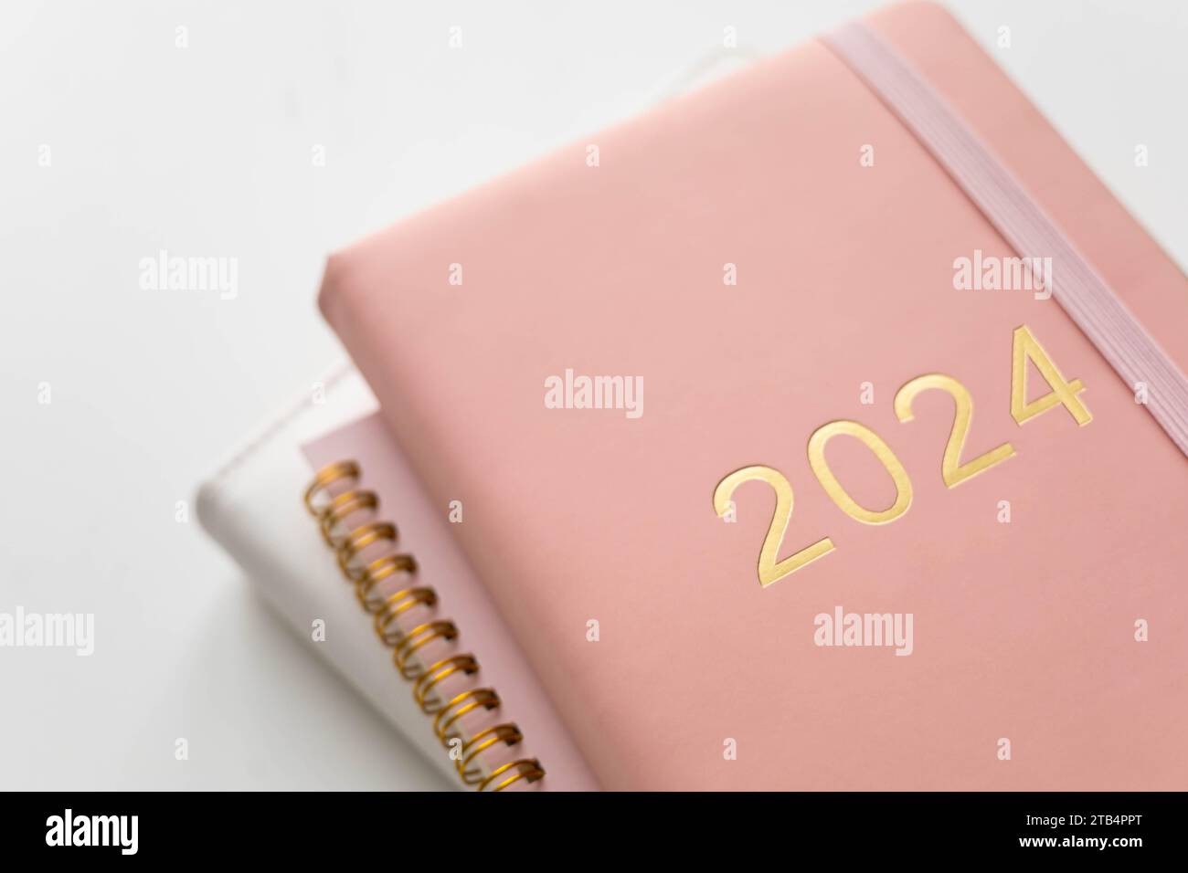 Pink coral colored diary for the year 2024 and many other diaries, pen ...